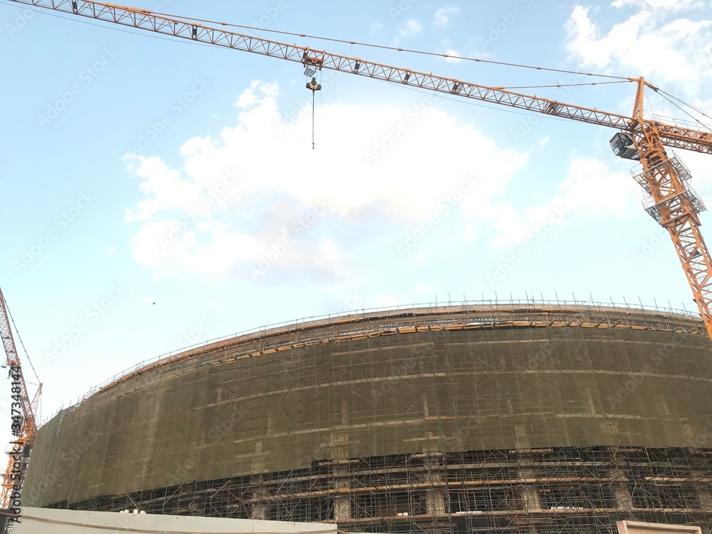 Project Site Construction under progress using tower crane and ...