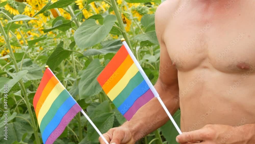 Beautiful body of a young man athletic man with beautiful muscles holds ...