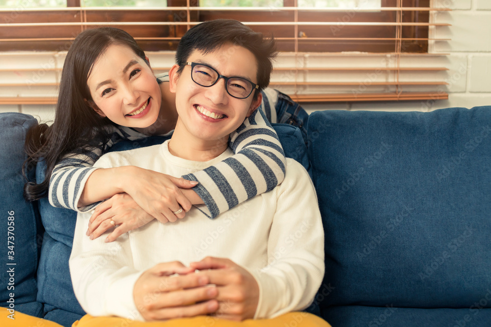 sweet asian marry couple happiness romantiv enjoy family moment at home wathching tv and enjoy ...