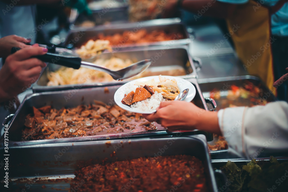 The concept of poverty leads to food shortages: homeless people wait to ...