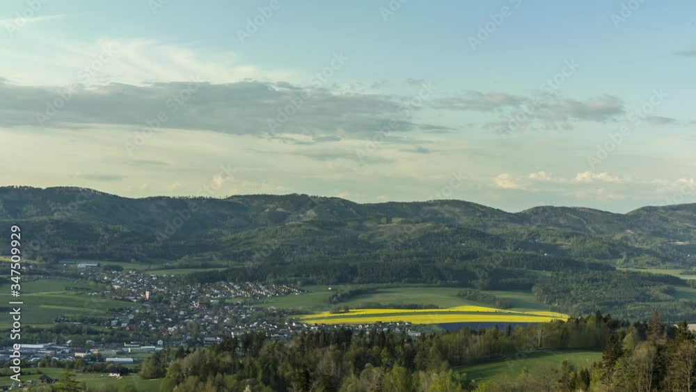 Side move clouds village timelapse that lies in a mountainous area ...