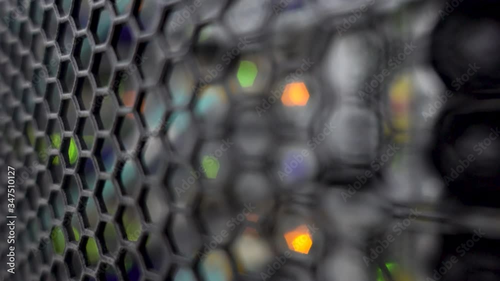 View through the honeycomb of the server rack. Abstract of modern high ...