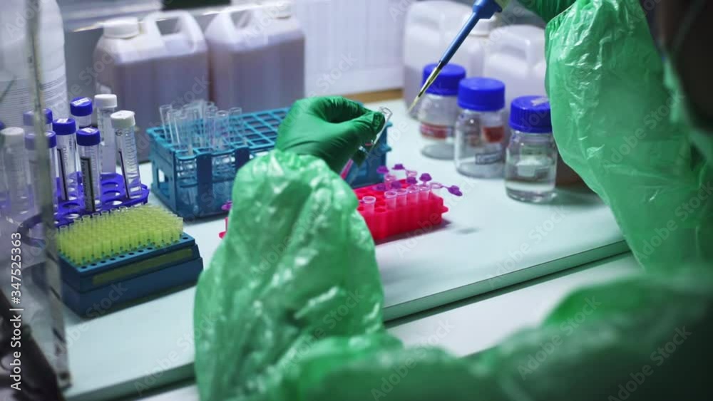 Close up scientist using pipette transfer sample to Micro Centrifuge ...