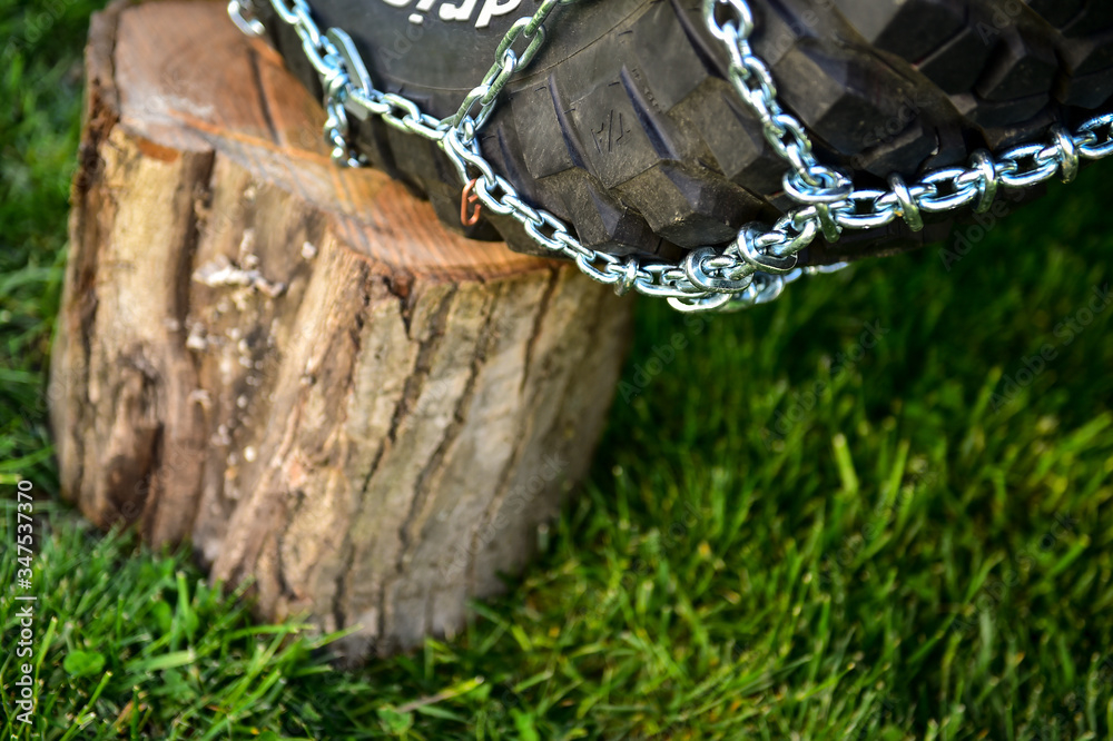 Tire chain for extra traction in mud and snow conditions on an off road ...