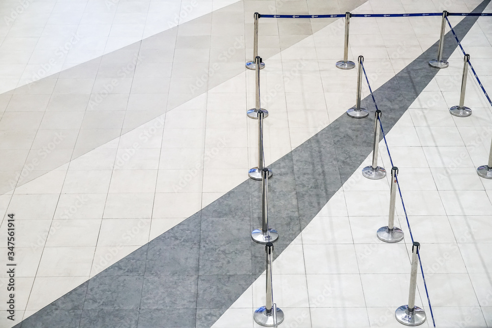 Empty airport check-in counter barricade rope with no body in the queue ...