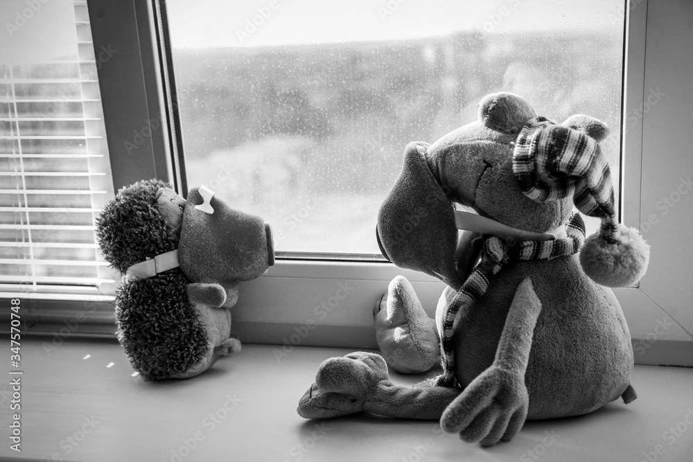 COVID19. The 2020 pandemic. Monochrome image. Two toys in the form of ...