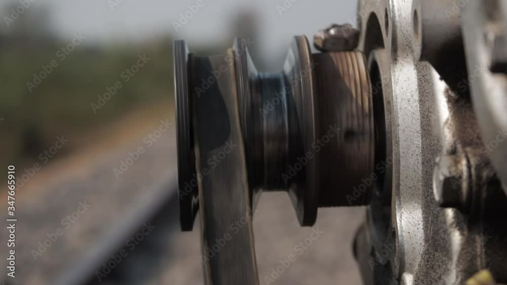 Bamboo Train Norry motor engine belt turning as train moves, closeup ...