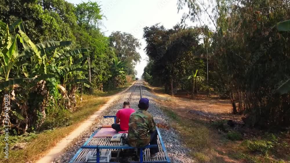 Bamboo Train norry driven by locals on rail track through Cambodia ...