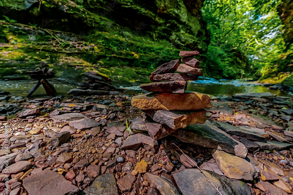 Man made balancing rock discovered in a hidden ravine with a small ...