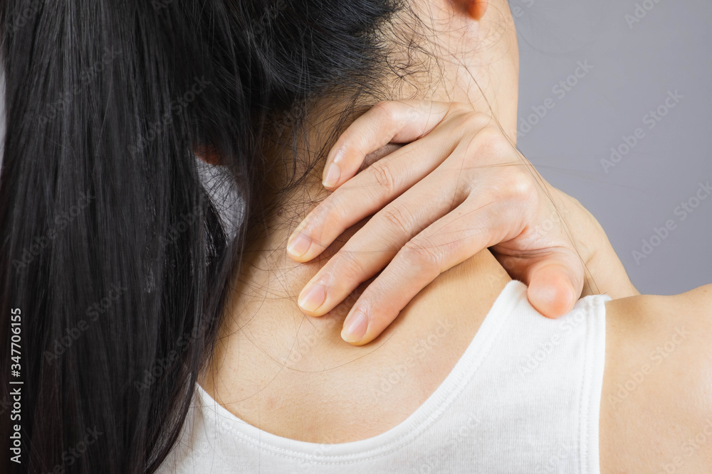 selective focus woman with neck pain.Acute pain in a female nape ...