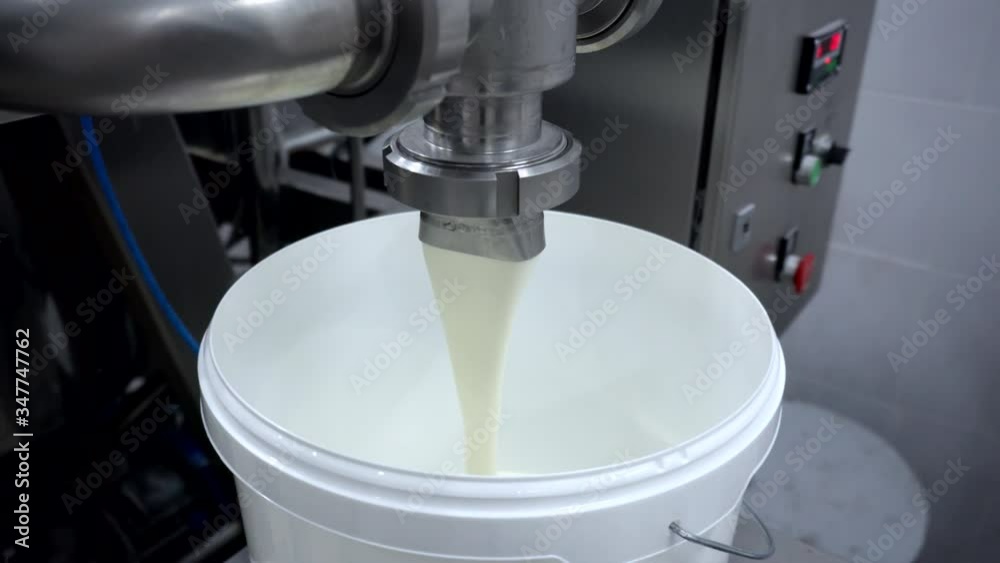 Production of condensed milk on an industrial scale. Condensed milk ...