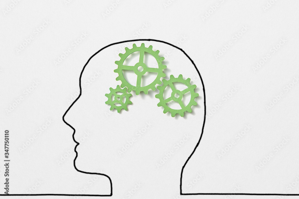 Drawn outline of human head with green clockwork as a working brain ...