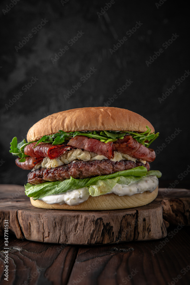 Delicious juicy burger from Brioche Bun, aged beef cutlet, bacon ...