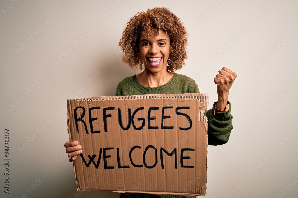 African american woman asking for immigration holding banner with ...