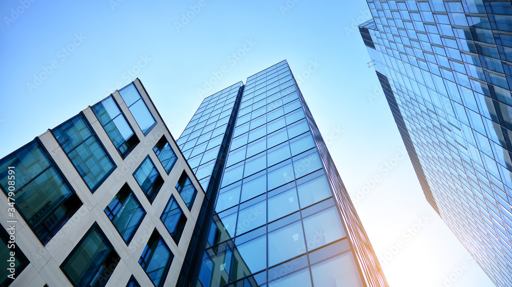 Bottom view of office building window close up with sunrise, reflection ...