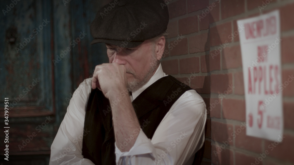 A well dressed unemployed man from the 1930s great depression era ...