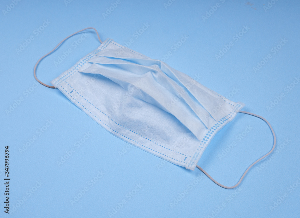 Surgical mask with rubber ear straps. Typical 3-ply surgical mask to ...