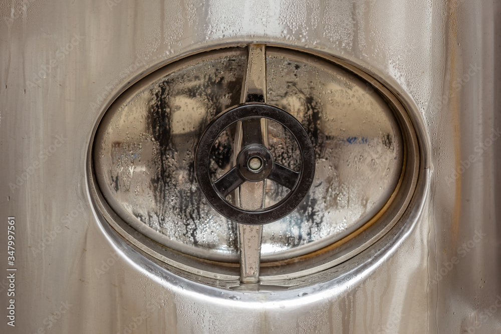 Brewery, closed hatch in a beer tank, cylinder-conical fermentation ...