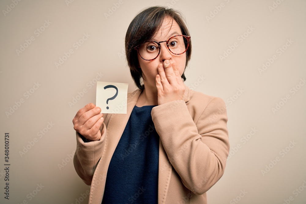 Young down syndrome business woman holding question mark paper as doubt ...