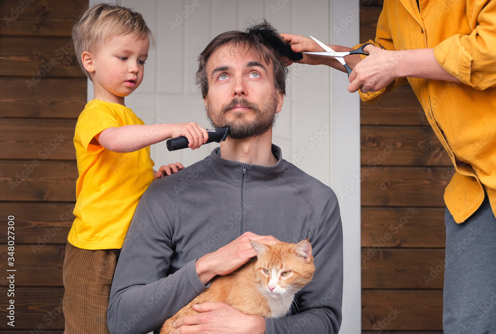 Family haircut at home during quarantine lockdown, domestic ...