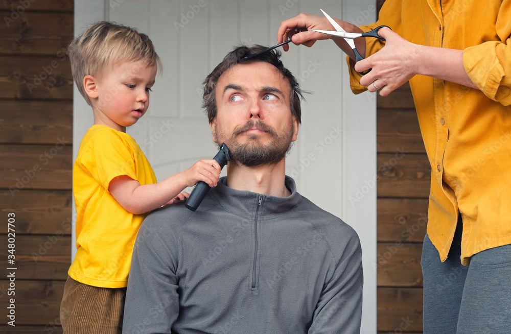 Family haircut at home during quarantine lockdown when closed all ...