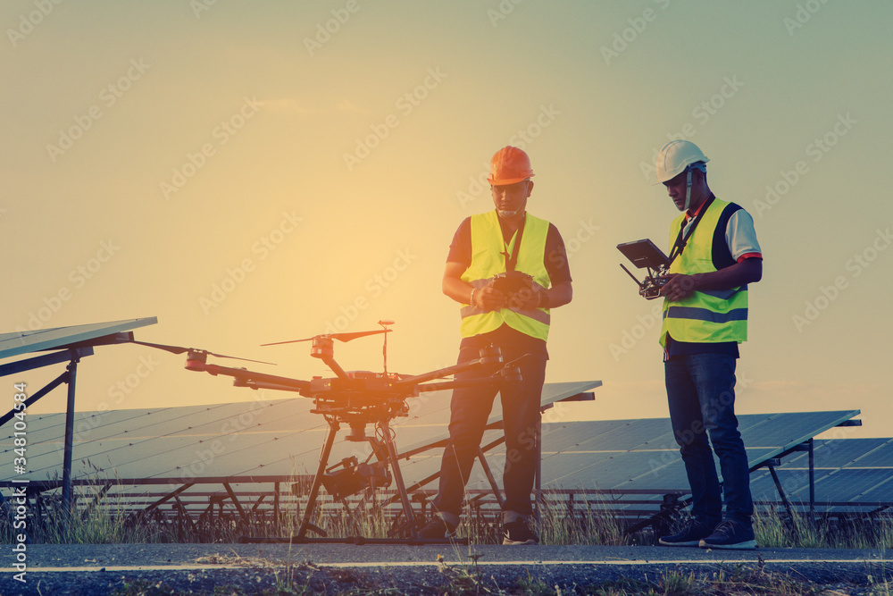 Engineer inspect and checking solar panel by Drone at solar power plant ...
