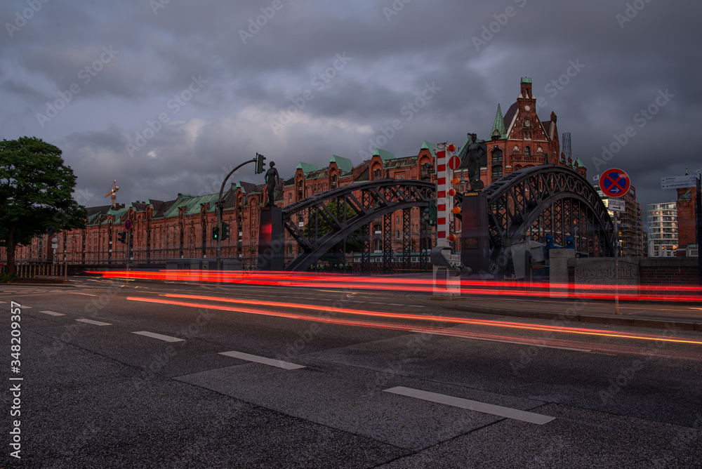 road in front of the storage city in hamburg with traffic lanes with an ...