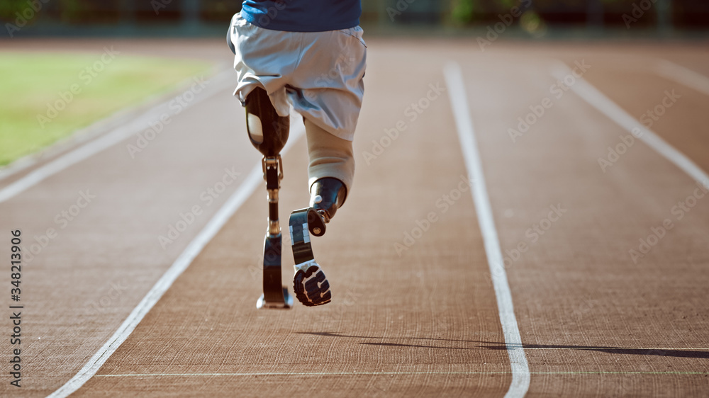 Athletic Disabled Fit Man with Prosthetic Running Blades is Training on ...