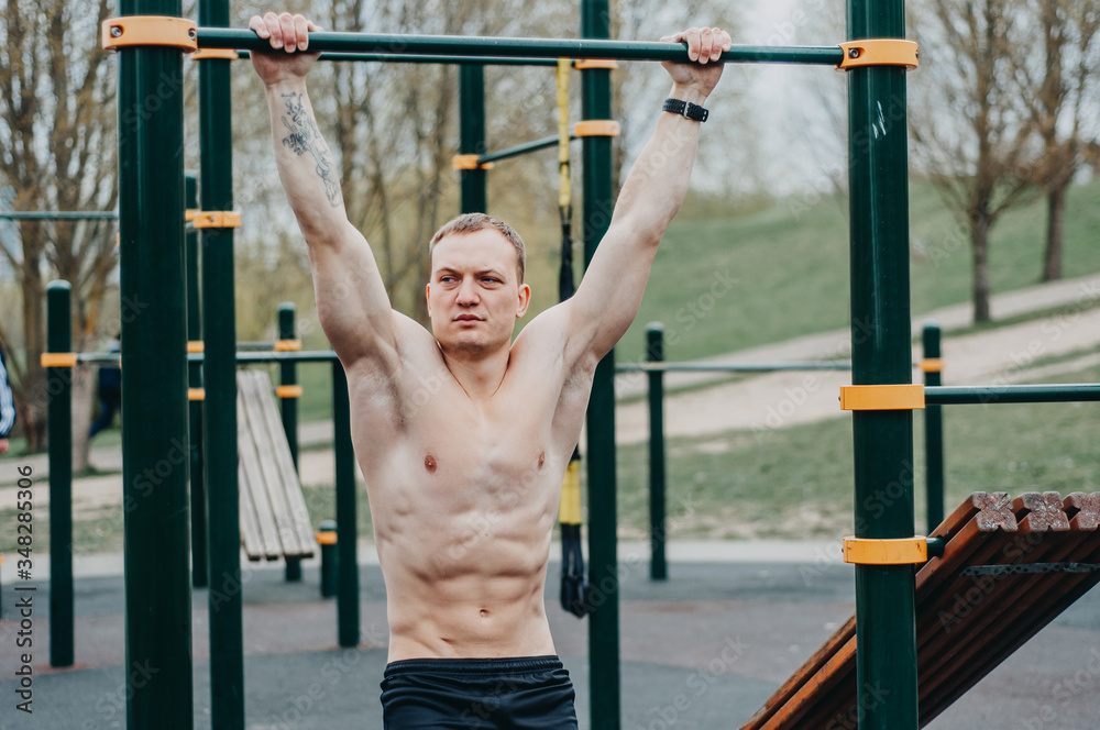 Fitness man with perfect body doing abdominal exercises in the Gym ...
