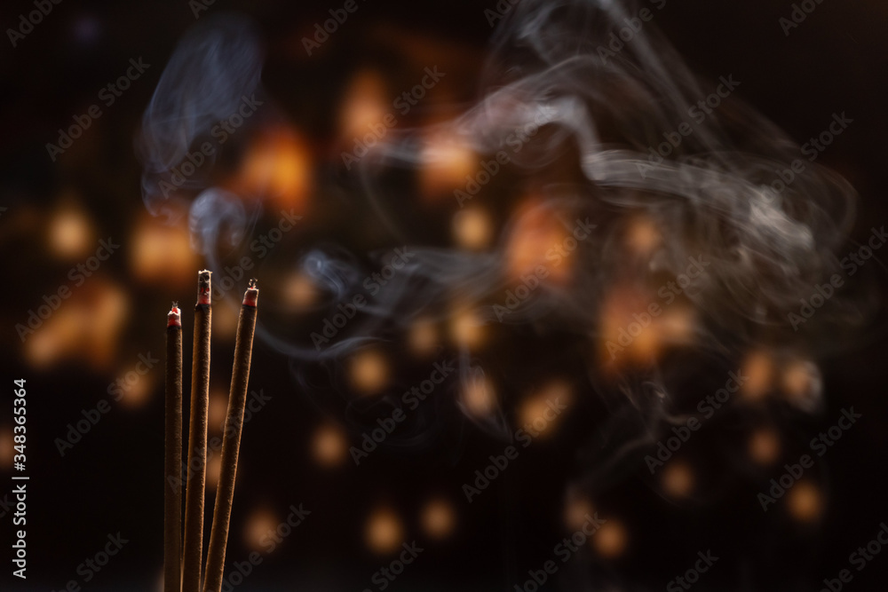 Burning Incense Sticks with smoke, joss sticks burning at a vintage ...