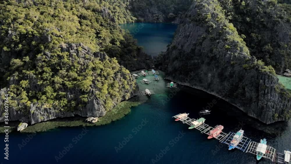 Aerial view of turquoise tropical lagoon with Karst limestone cliffs in ...