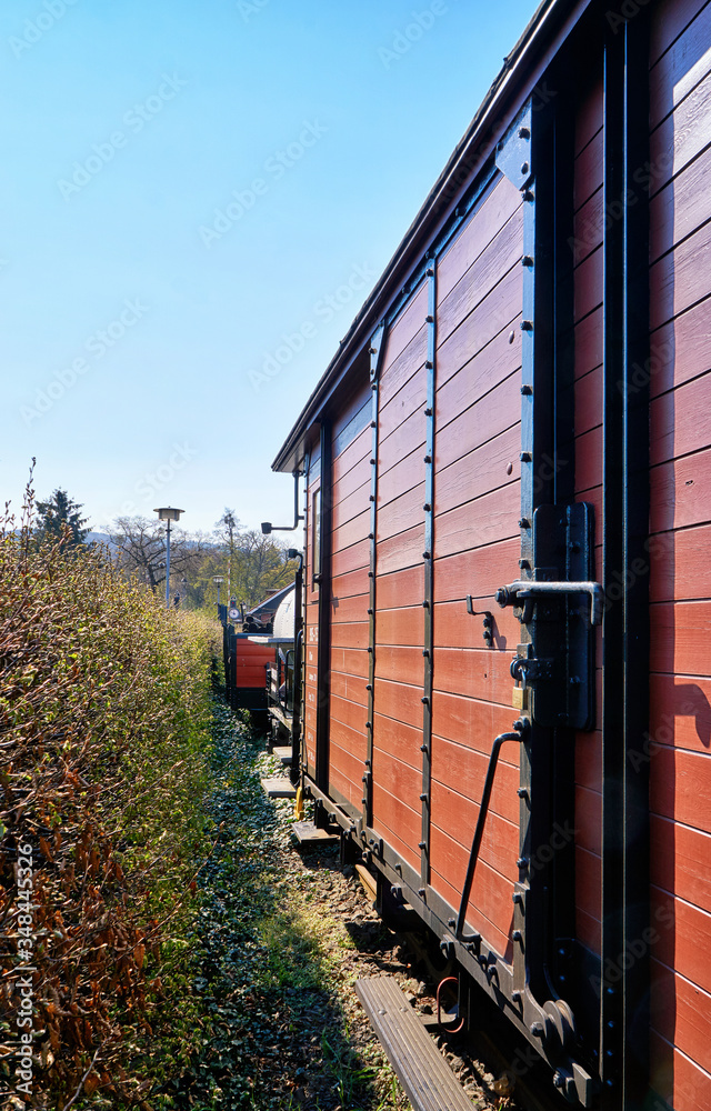 Red wood wagon of the steam locomotive at the train station. Stock ...
