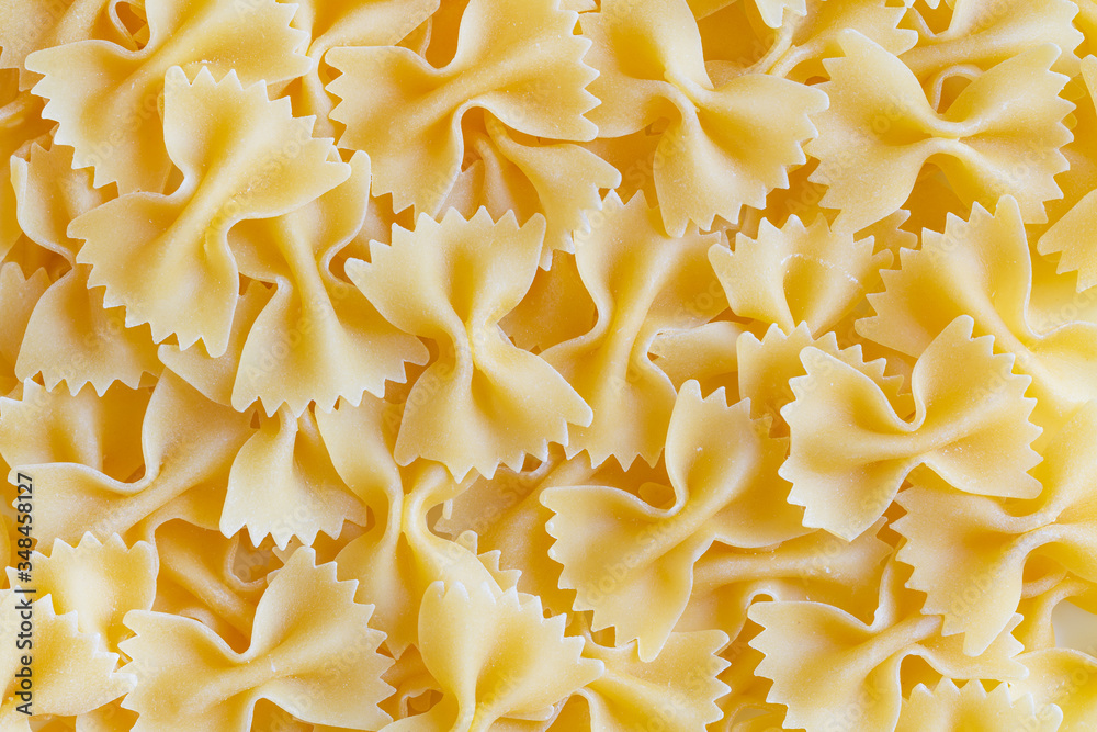 High-quality farfalle pasta background. Raw organic farfalle ...