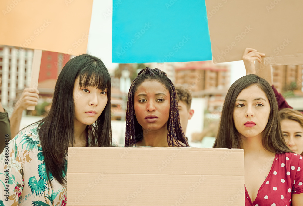 People protesting against multicultural opinion. Young people from ...