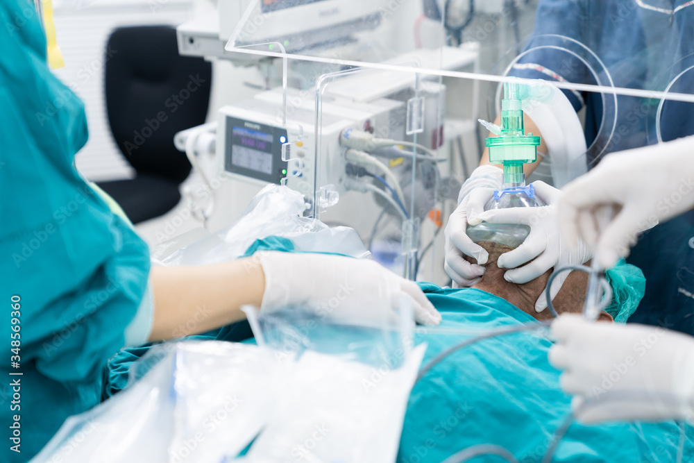 doctor pre oxygenation patient under plastic box Stock Photo | Adobe Stock