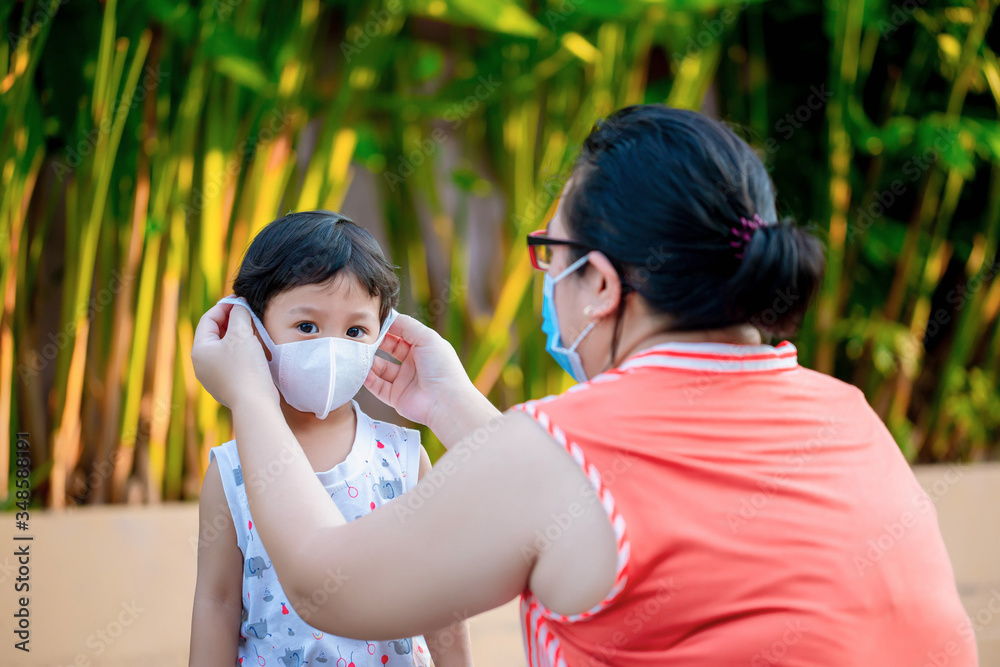 Mother and child wear facemask during coronavirus and flu outbreak ...
