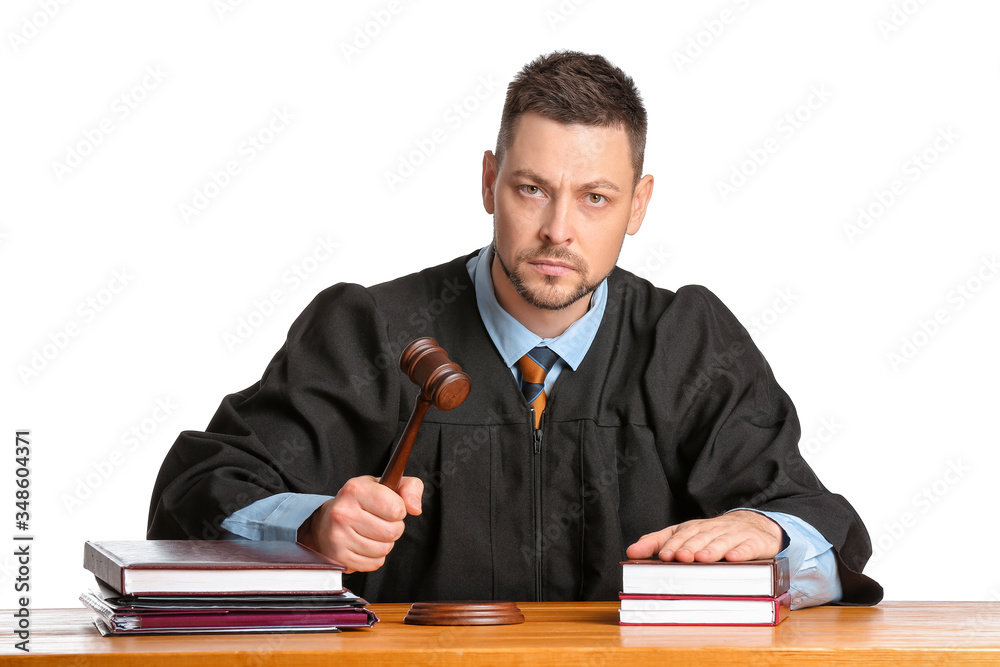 Strict male judge at table on white background Stock Photo | Adobe Stock
