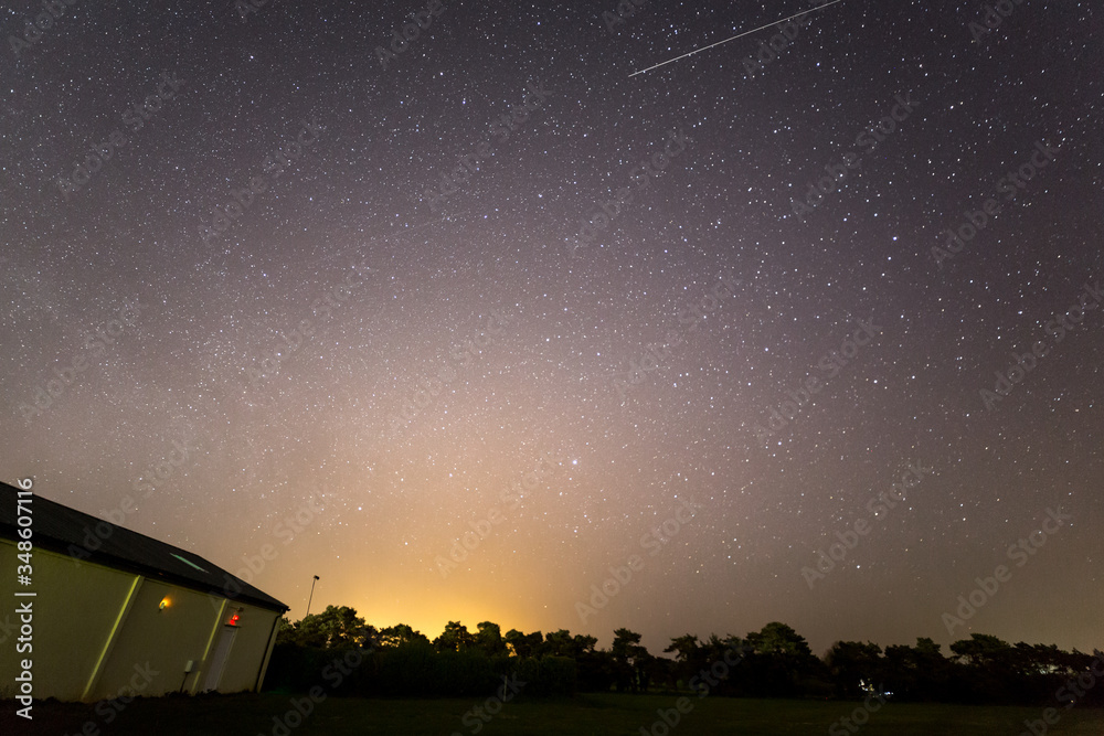 Light Trail of Starlink Satellites from SpaceX showing them flying over ...