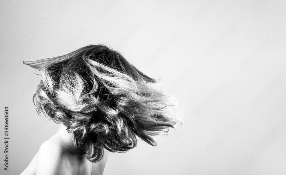 Toss and flip hair, back view. Black and white stock photo of a girl ...