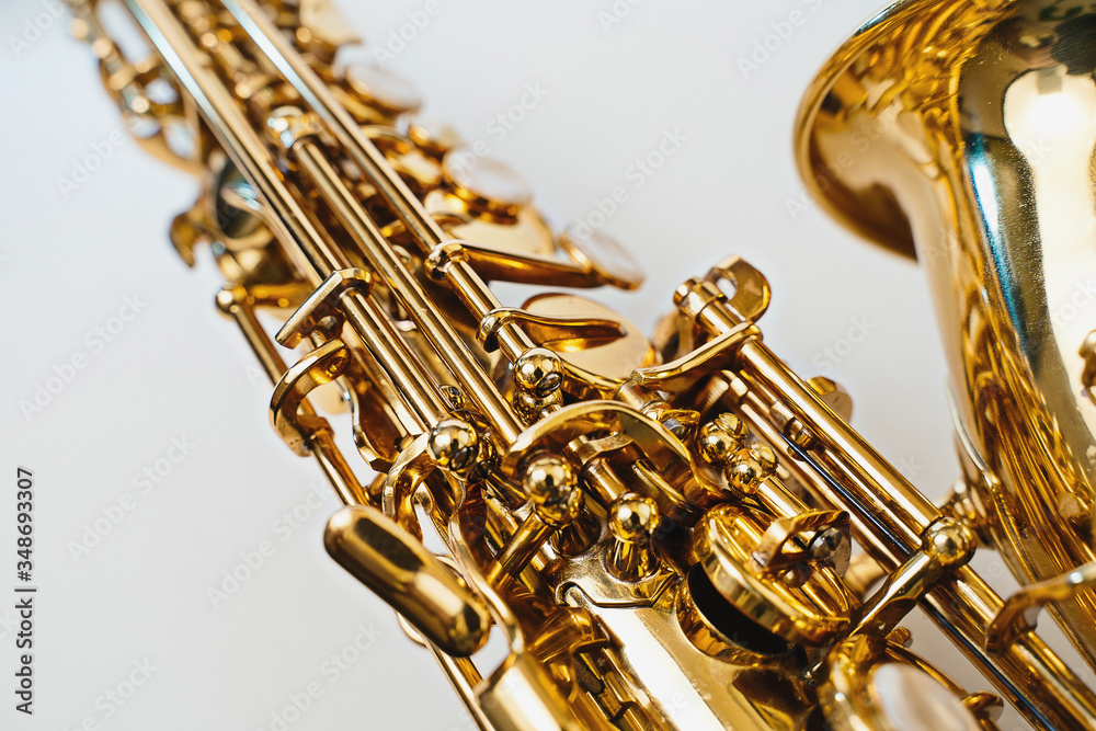 Details of the saxophone are golden in color. The cogs, the valve Stock ...