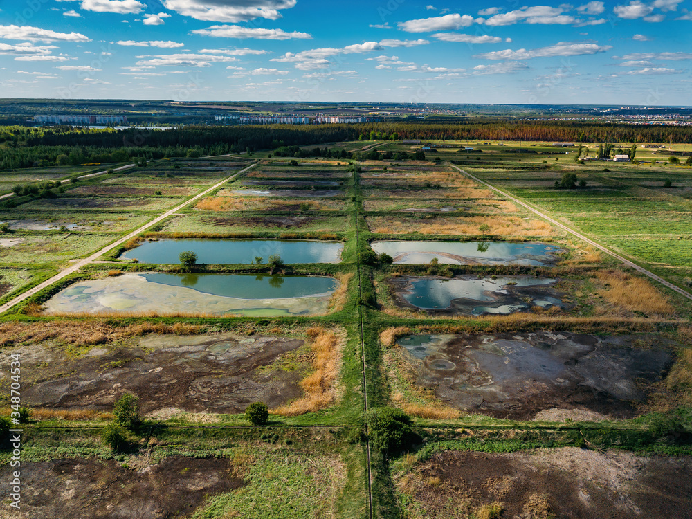 Natural sludge sumps for wastewater treatment, aerial view Stock Photo ...