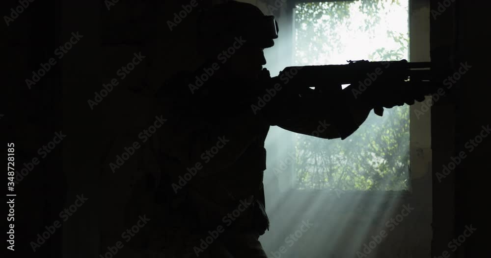 Special Forces soldiers combat uniforms fighting in battle aiming gun ...