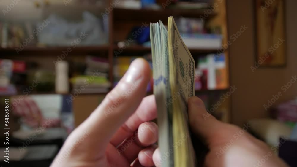 Flipping of dollars stack 100 bills banknotes POV point of view living ...