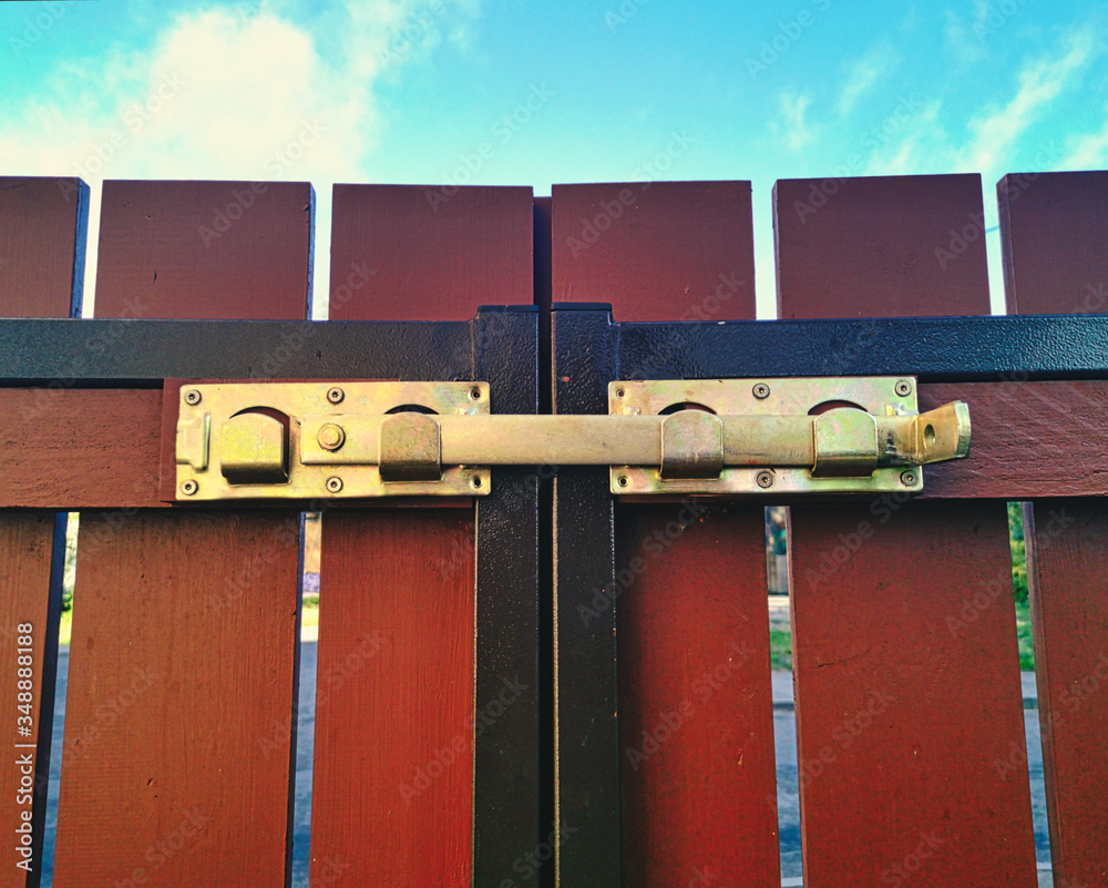 Abstract concept close-up of gold brown gate closed latch symbol of no ...
