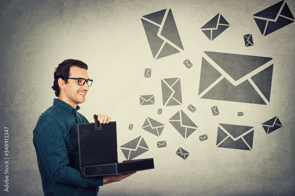 Businessman opens briefcase filled with different messages as lots of ...