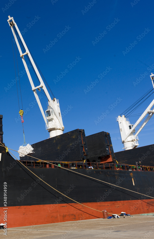 Loading rice on a ship in port Stock Photo | Adobe Stock