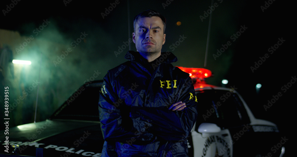 Portrait of police officer with serious faces looking at camera. FBI ...