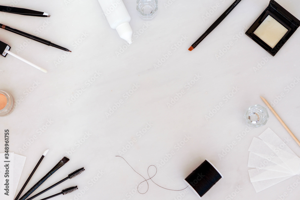 Brow beauty background in a flat lay style with treatment tools ...