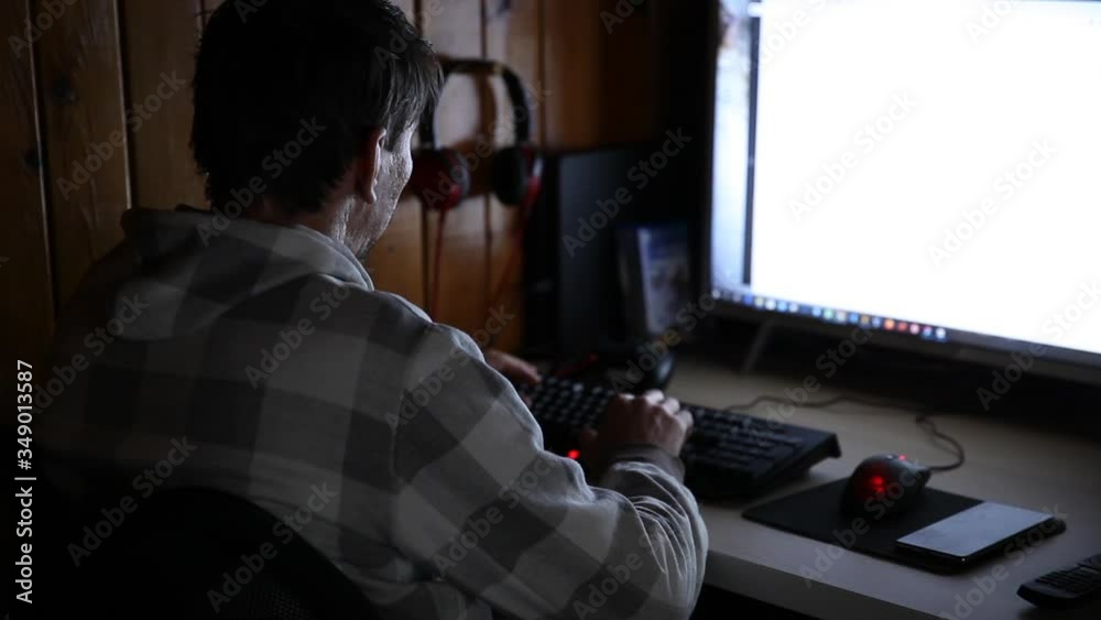 Programming concept. Man programmer working on computer at home coding ...