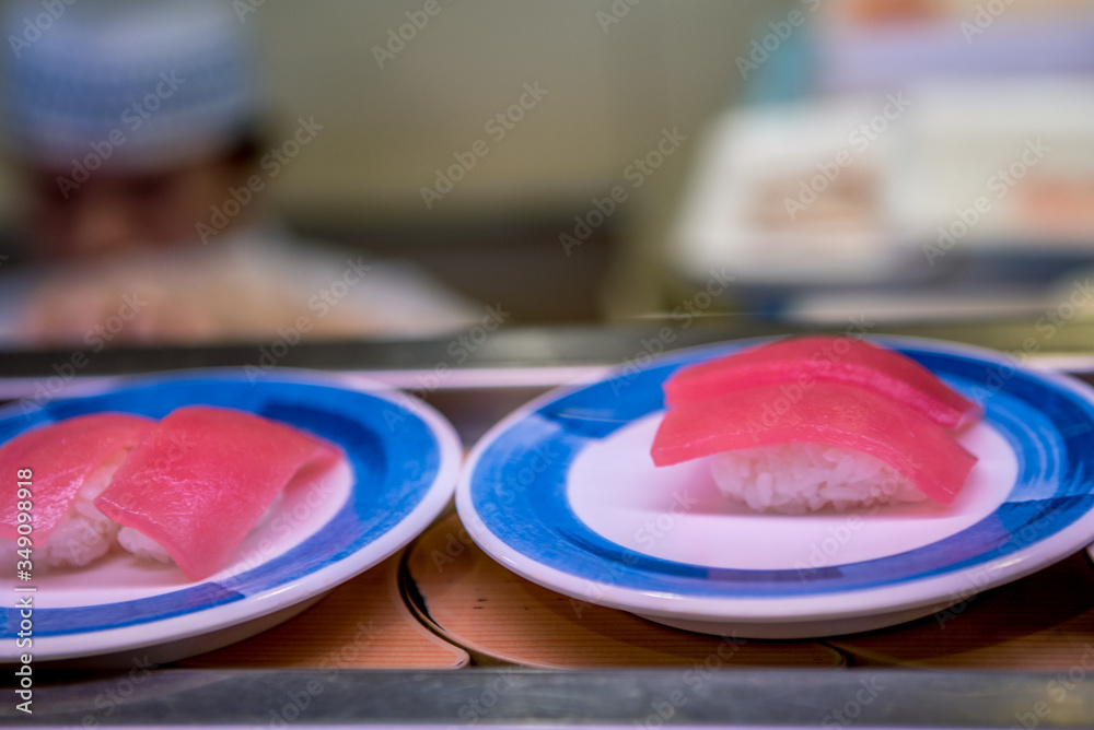 Sushi on conveyor belt in Japan restaurant. Traditional Kaitenzushi ...